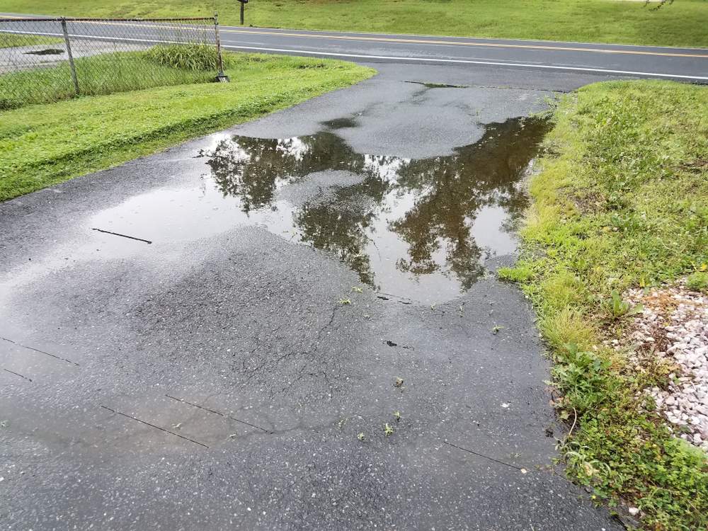 Fixing Water Pooling on Your Driveway - Richfield Blacktop