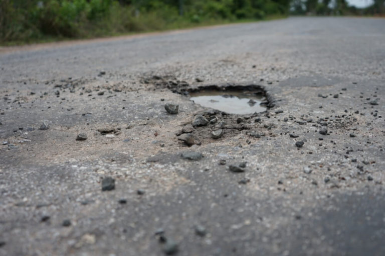 Understanding the Causes of Asphalt Potholes in Minnesota